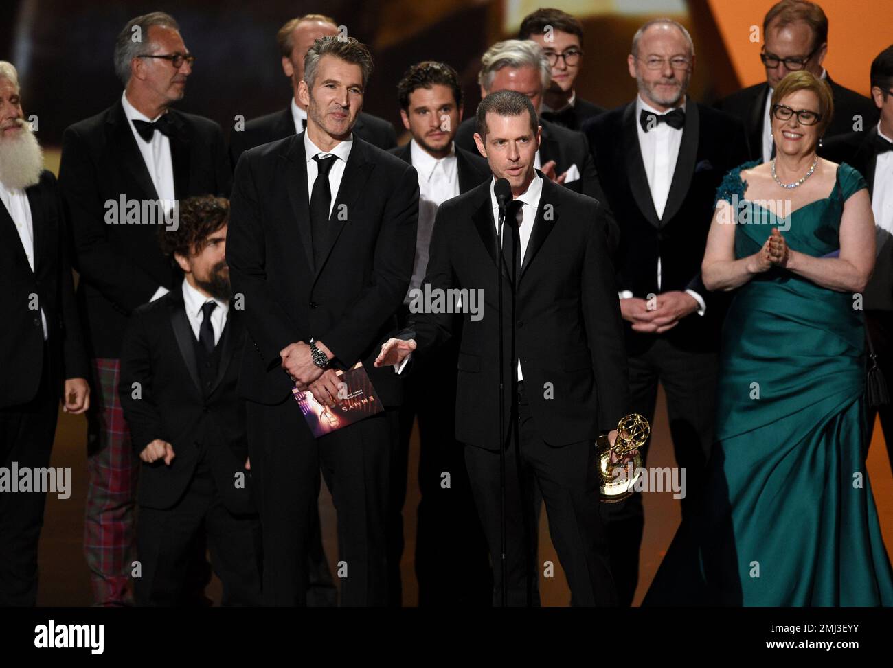 David Benioff, center left, and D.B. Weiss accept the award for ...