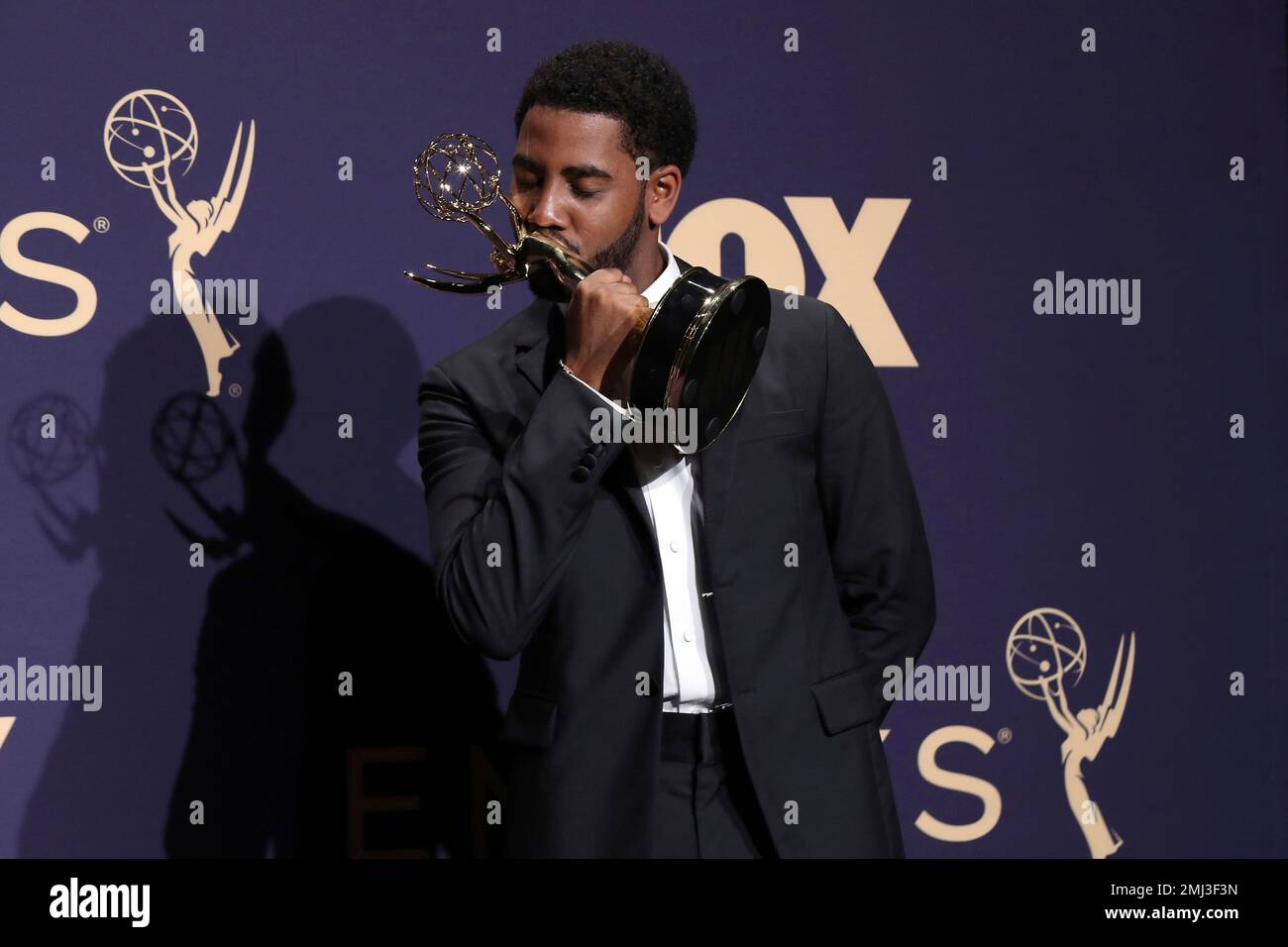Jharrel Jerome poses in the press room with his award for outstanding ...