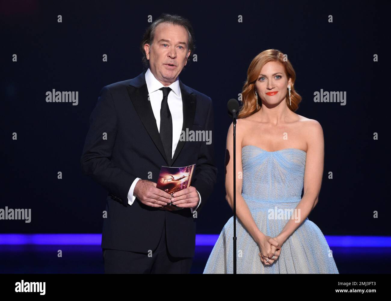 Timothy Hutton, left, and Brittany Snow present the award for ...