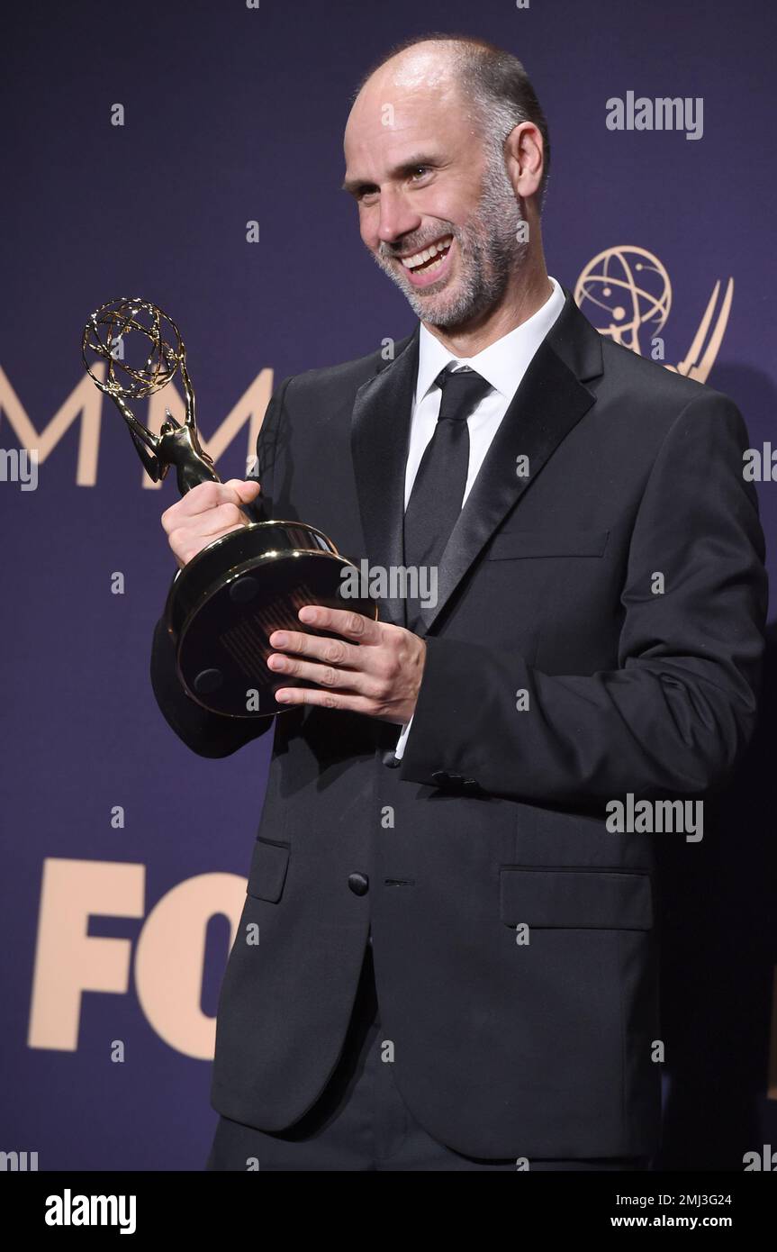 Jesse Armstrong poses in the press room with the award for outstanding ...