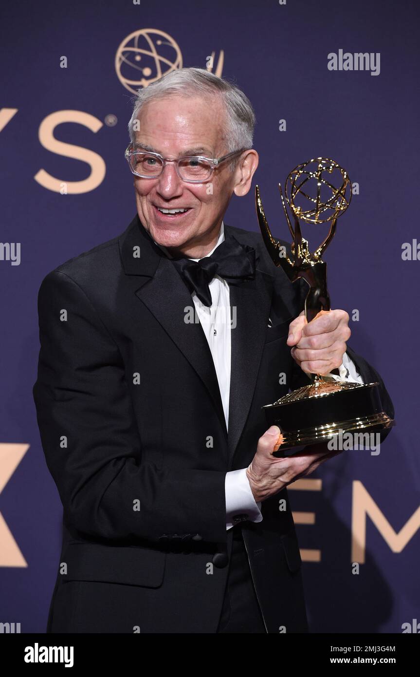 Don Roy King poses in the press room with the award for outstanding ...
