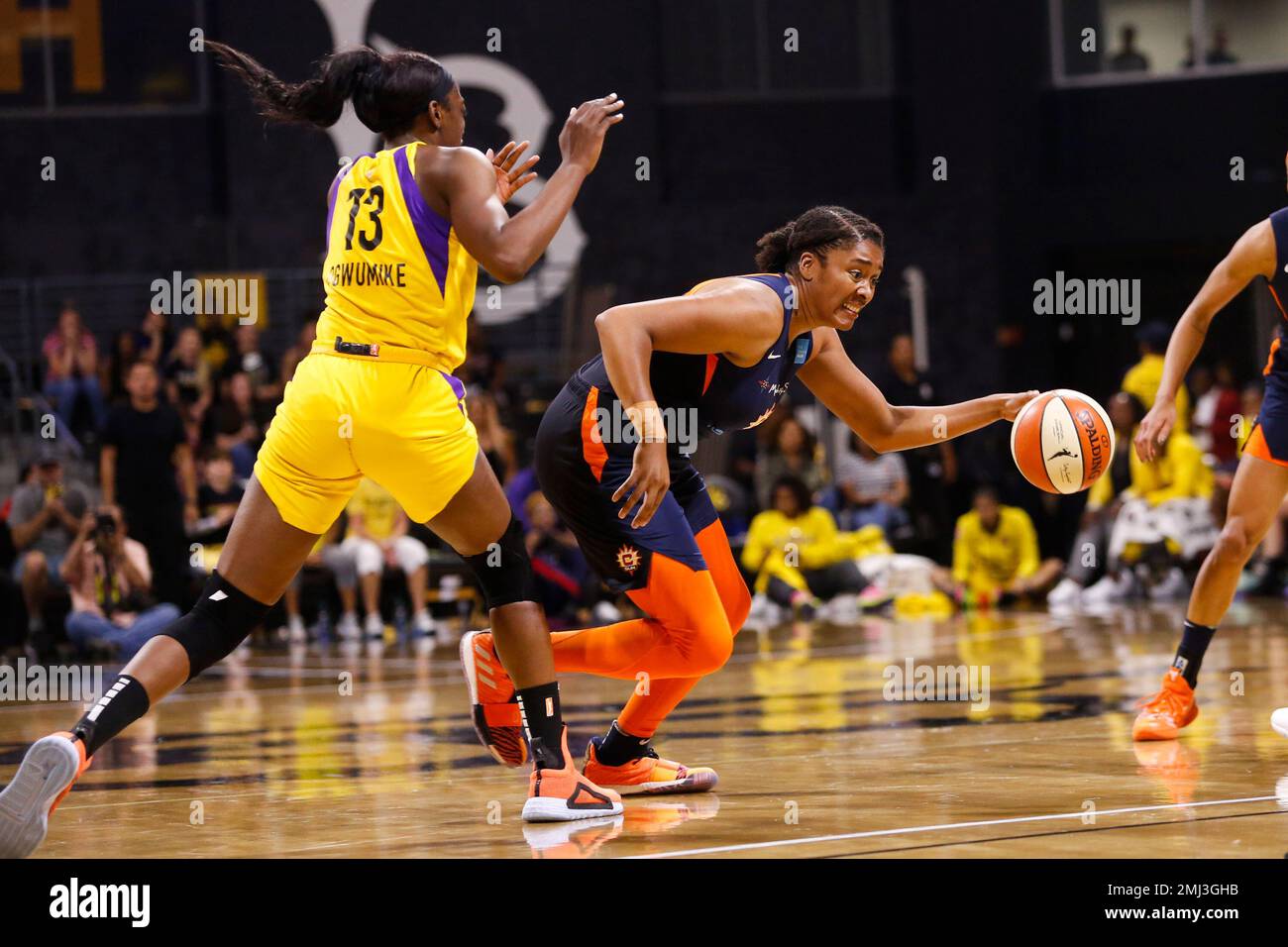 Connecticut Sun's Morgan Tuck (33) drives past Los Angeles Sparks ...