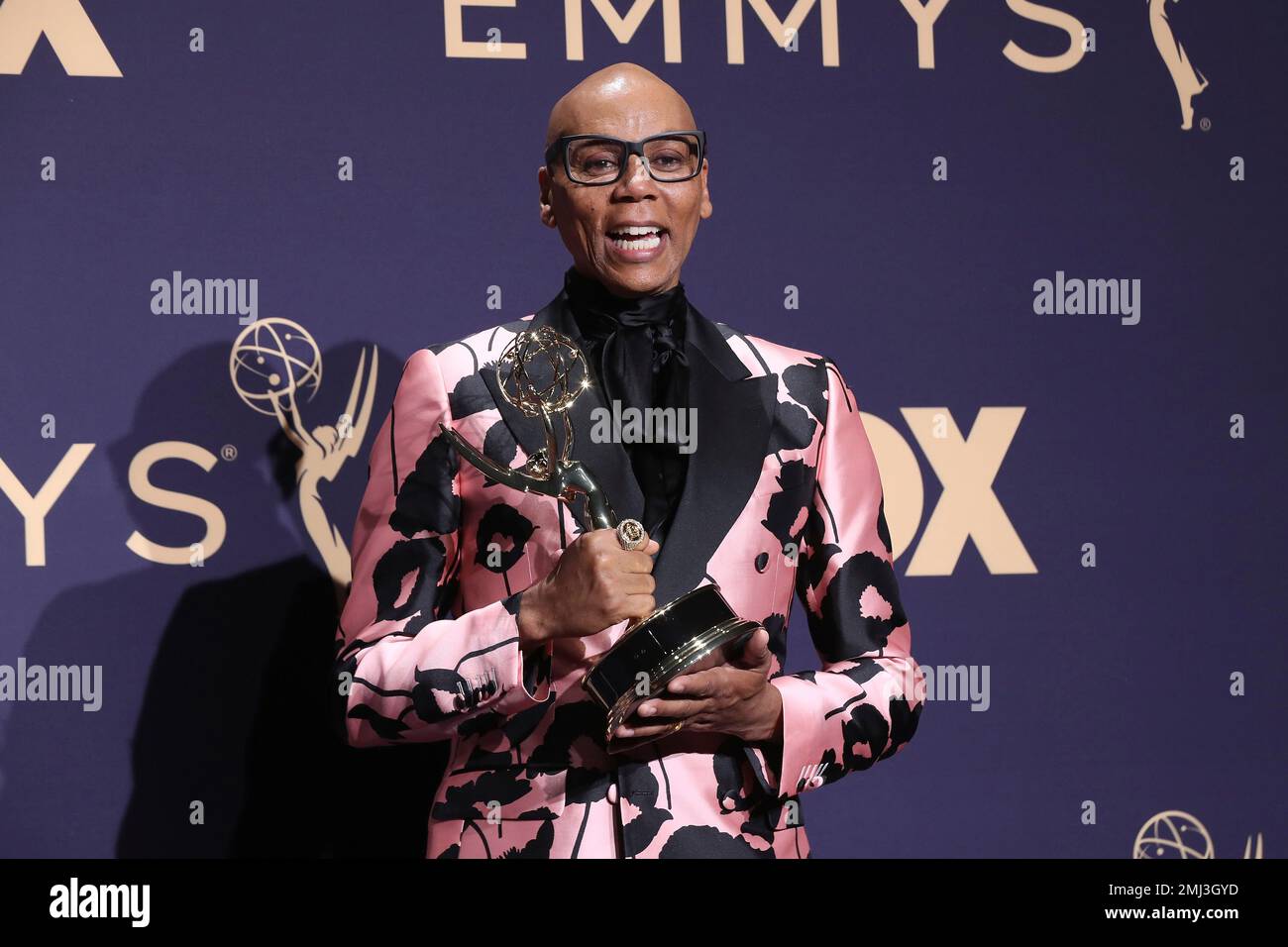 RuPaul poses in the press room with the award for "outstanding ...