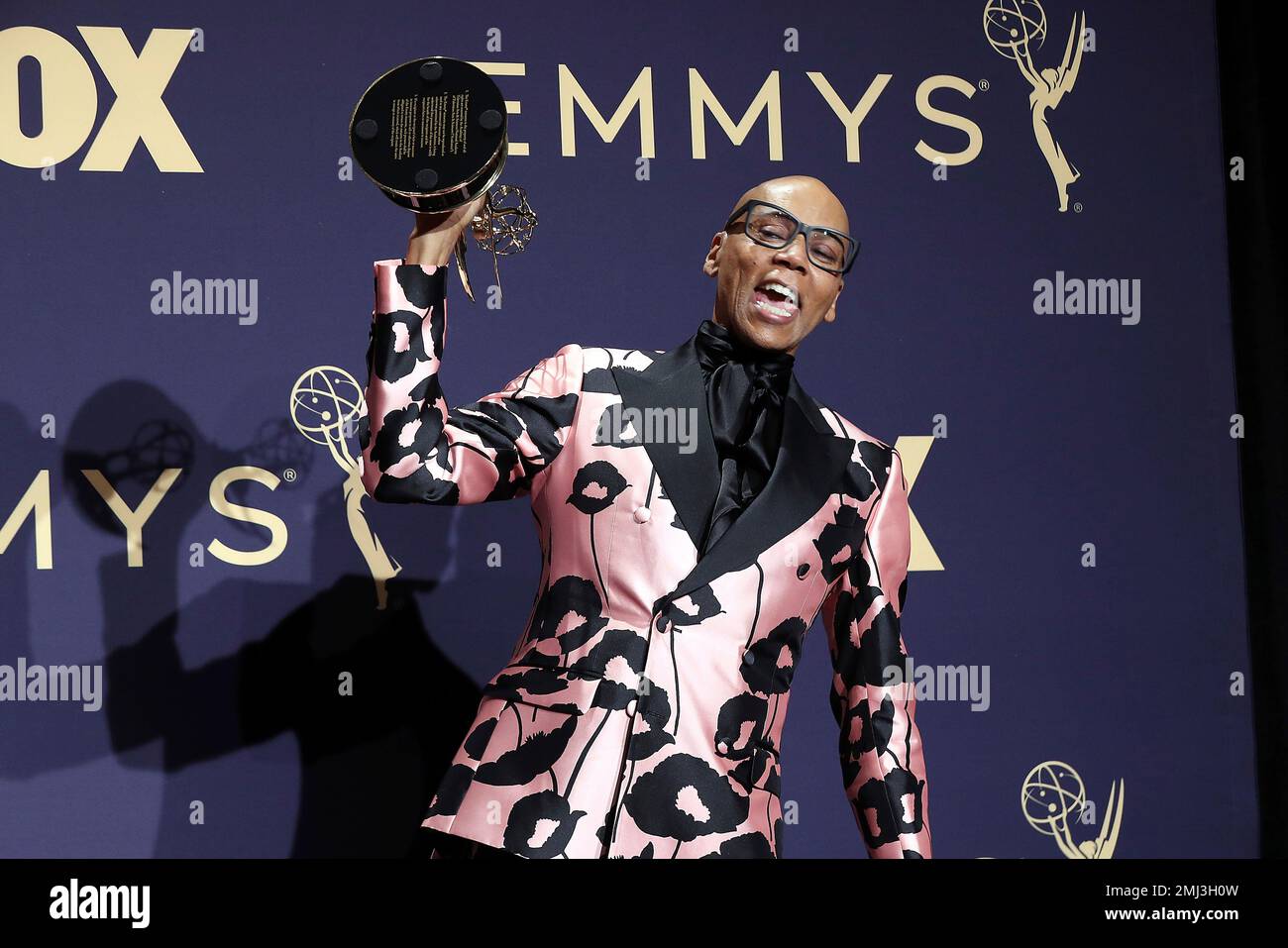 RuPaul poses in the press room with the award for "outstanding ...