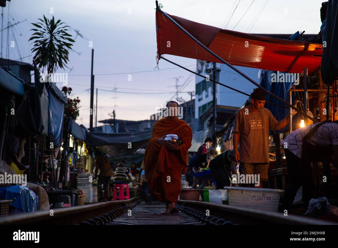 Monk Walking Through the Rom Hup Market at Night - Thailand Stock Photo ...
