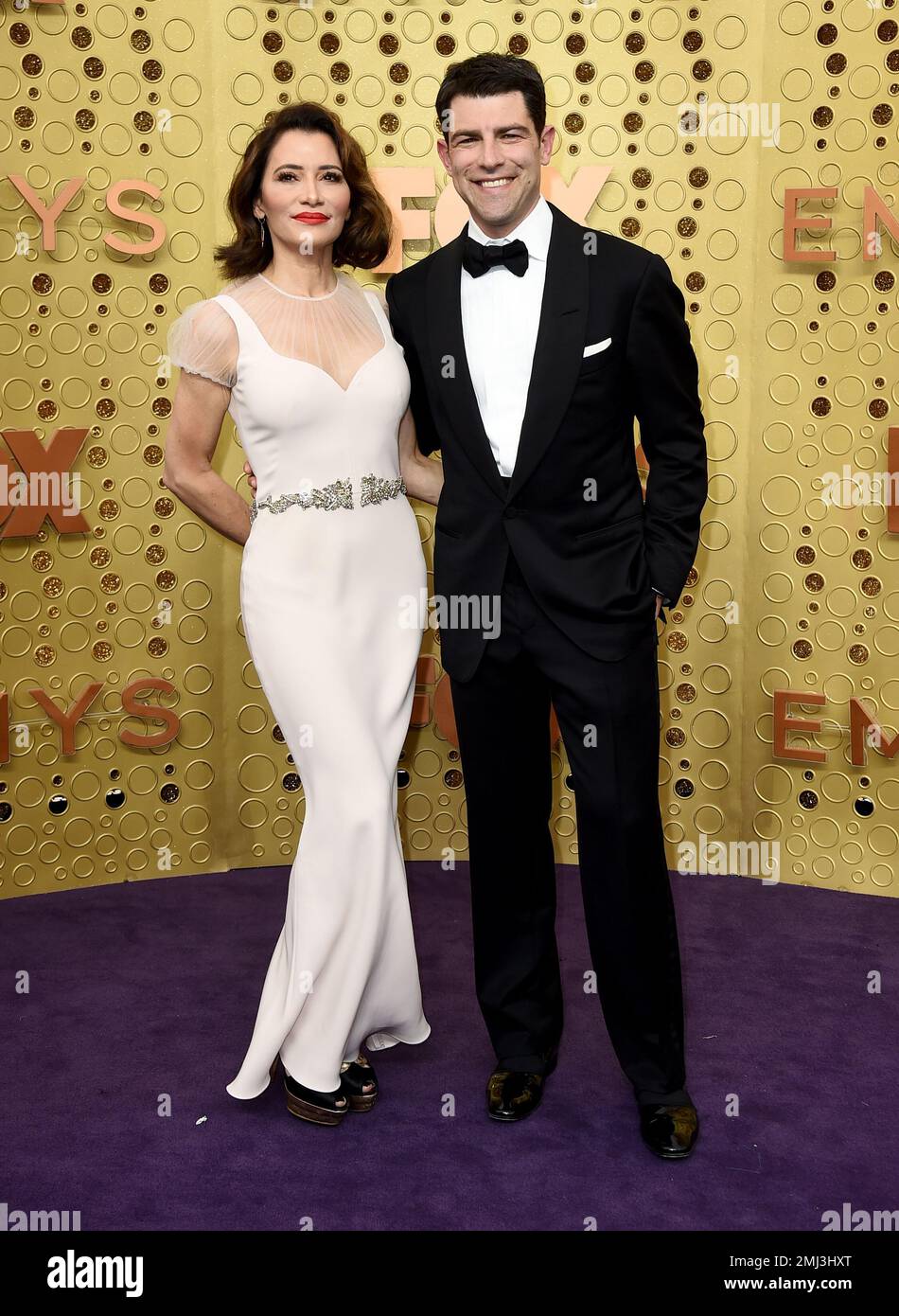 Tess Sanchez, left, and Max Greenfield arrive at the 71st Primetime ...