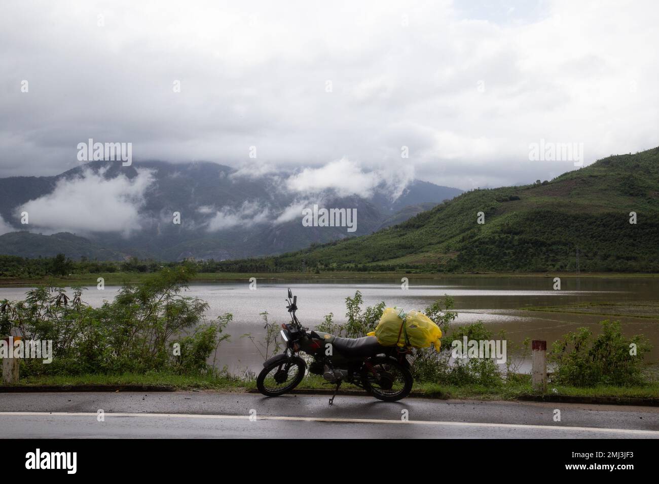 Honda Win 110 with Waterproof Bag in Front of Landscape - Vietnam Stock ...