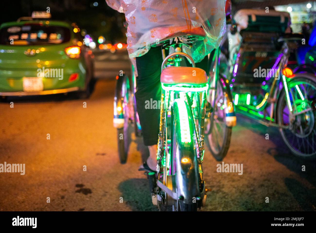 Neon Light on Cycle Rickshaw - Vietnam Stock Photo - Alamy