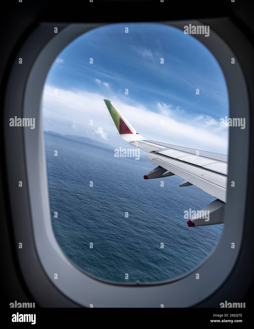 TAP Portugal, aeroplane wing, view out of the window to the sea ...
