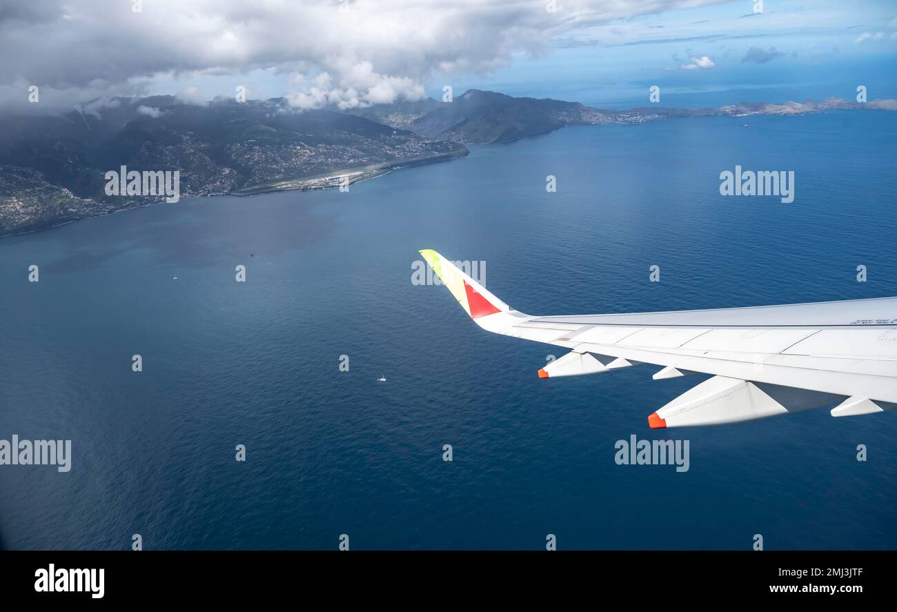 TAP Portugal, aeroplane wing, view out of the window to the sea ...