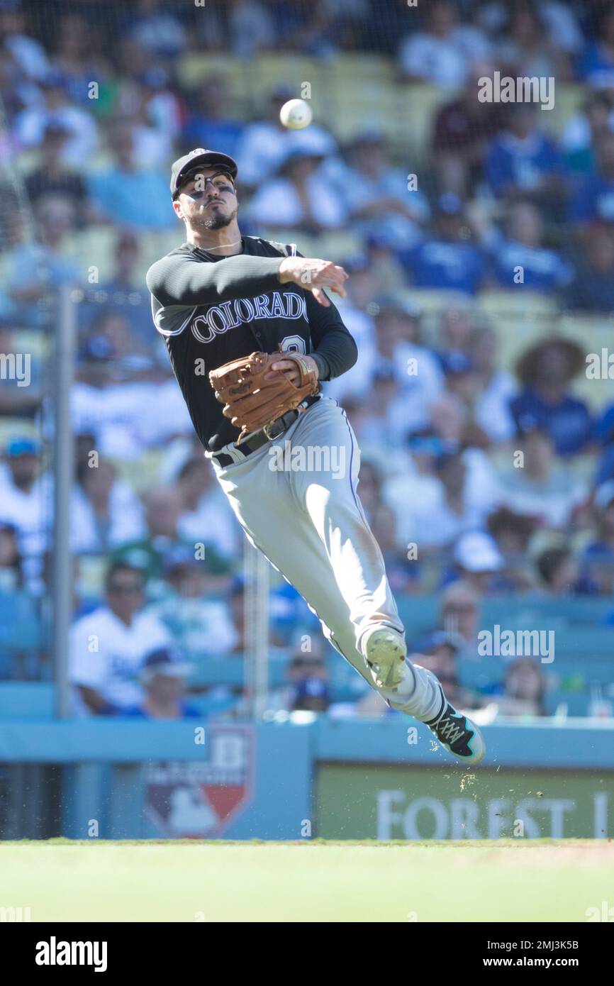 Colorado Rockies third baseman Nolan Arenado makes a throw to first ...