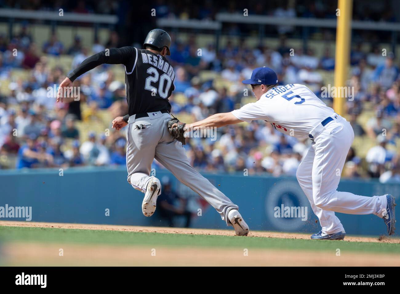 Los Angeles Dodgers shortstop Corey Seager, right, tags Colorado ...