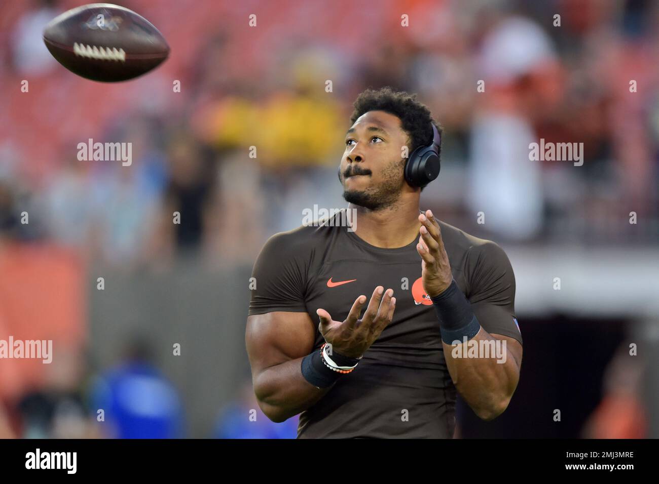 Cleveland Browns defensive end Myles Garrett catches a pass during warm ...