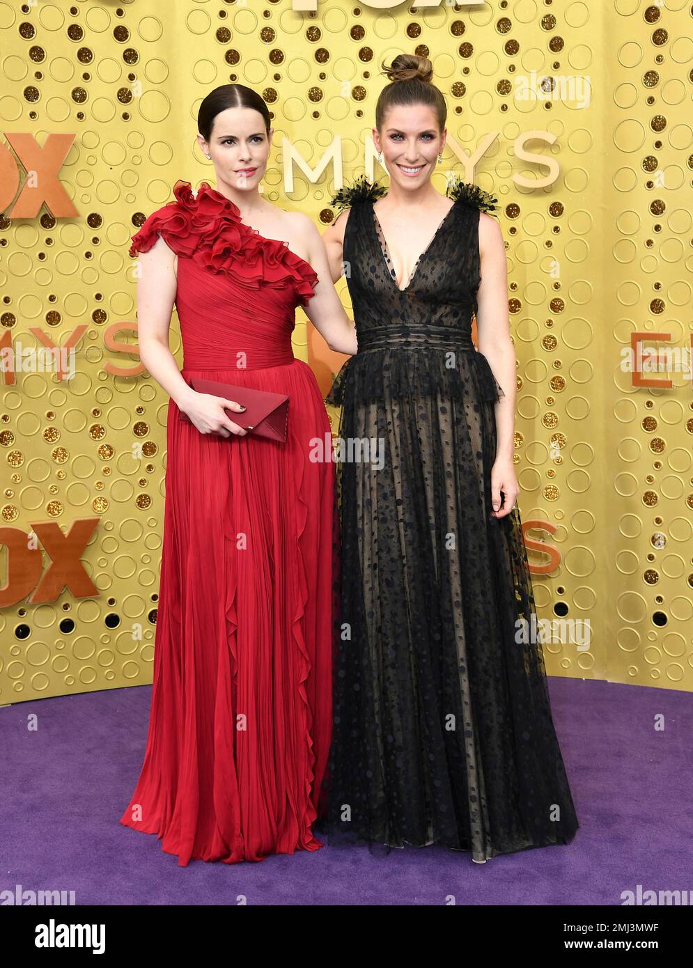 Emily Hampshire, left, and Sarah Levy arrive at the 71st Primetime Emmy ...