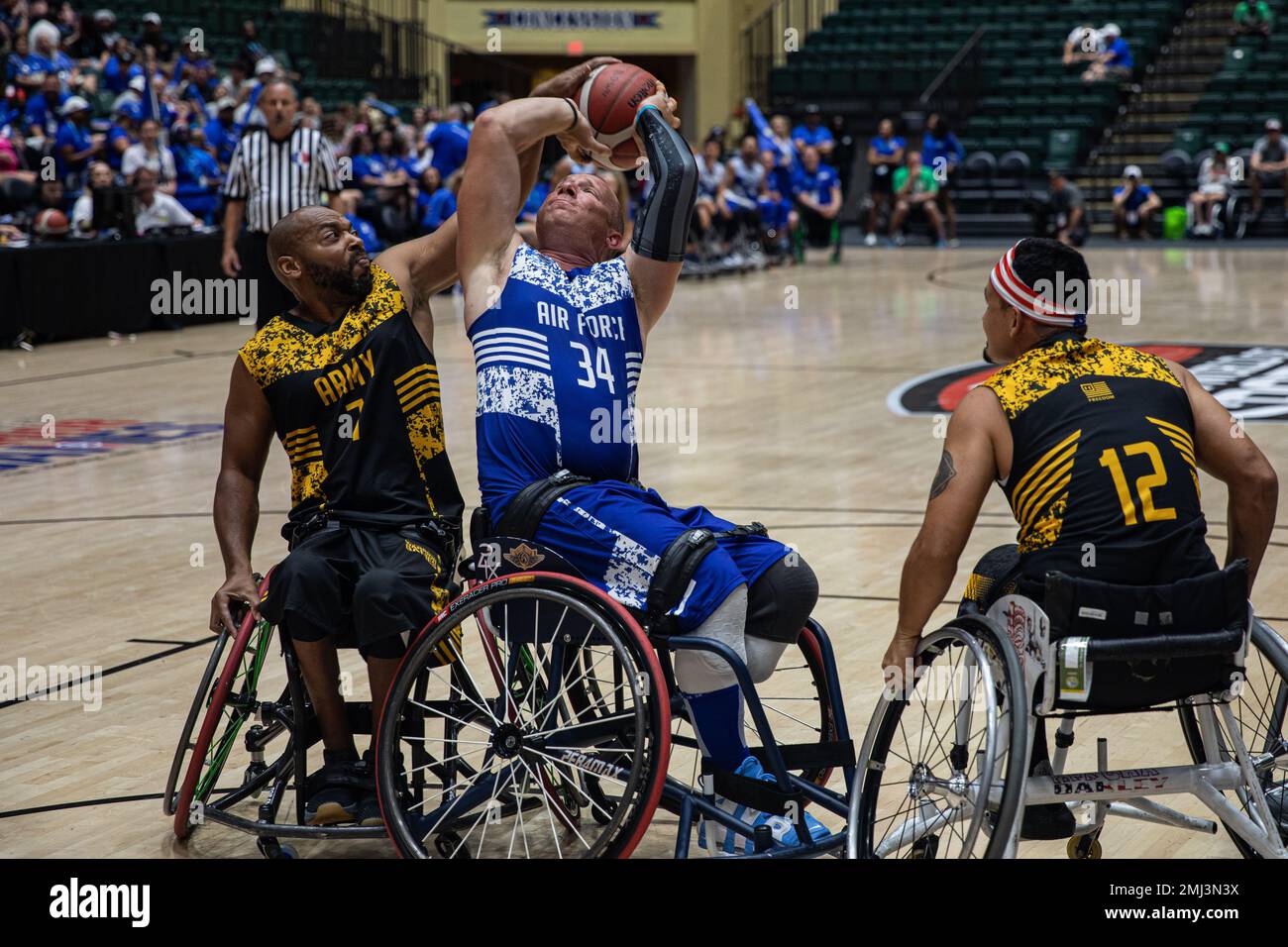 Retired U.S. Army Spc. Brent Garlic blocks a shot during the gold medal ...