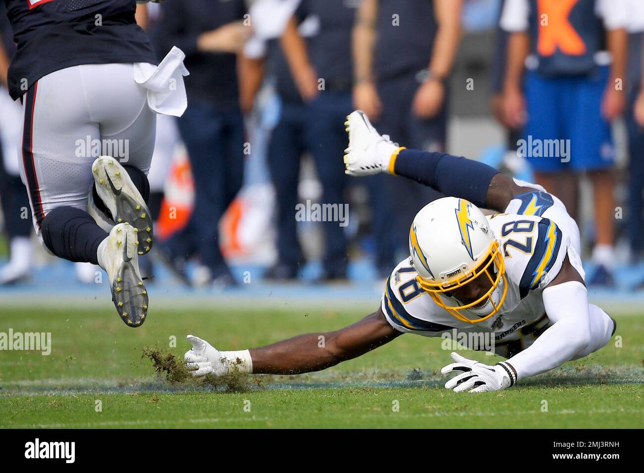 Houston Texans running back Duke Johnson, left, breaks away from Los ...