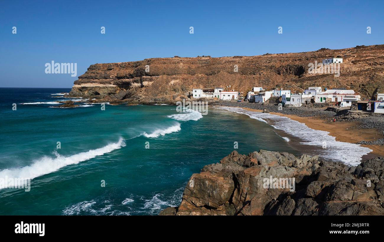 Puertito de los Molinos, whole beach, waves, surf, several small white ...