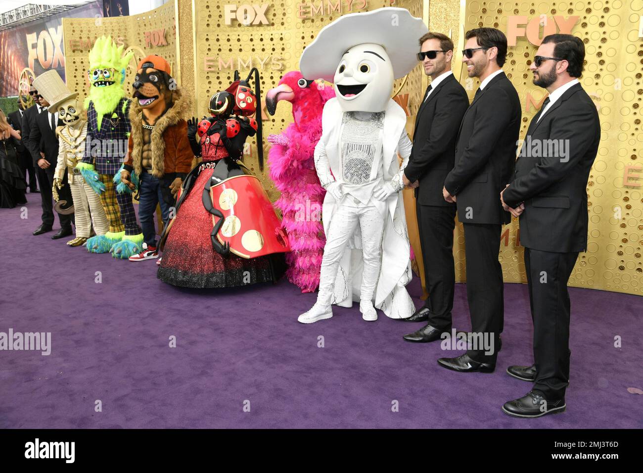 Members of the cast of "The Masked Singer" arrive at the 71st Primetime ...