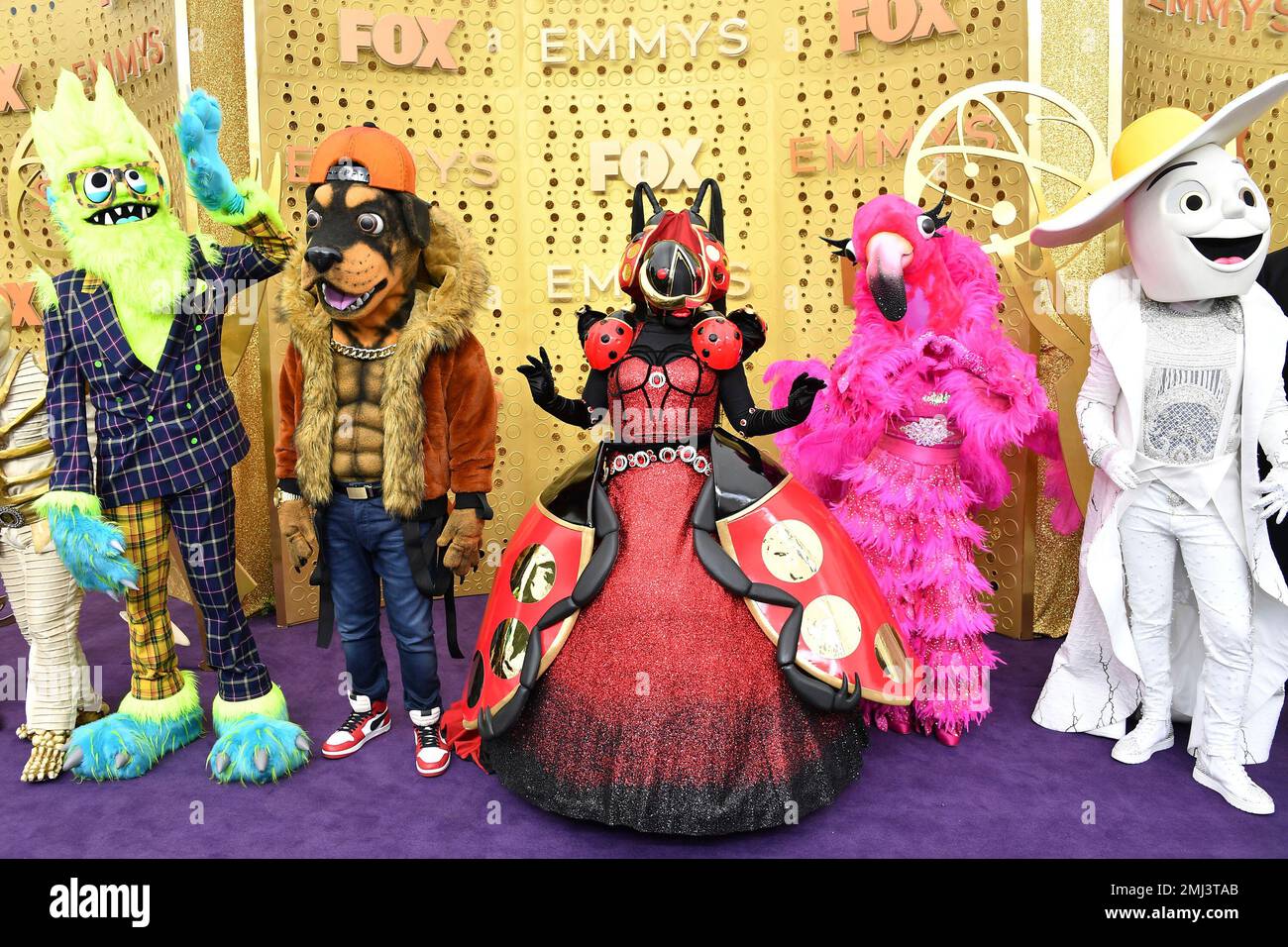 Members of the cast of "The Masked Singer" arrive at the 71st Primetime ...