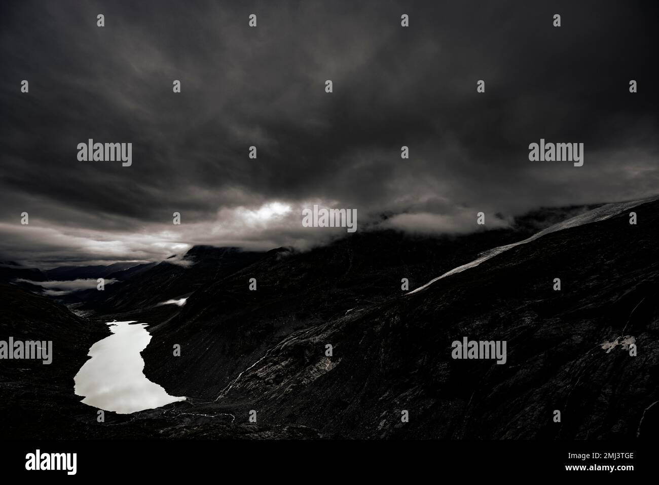 Mountain lake Lej da Vadrett with Val Rosegg and dramatic clouds, St ...