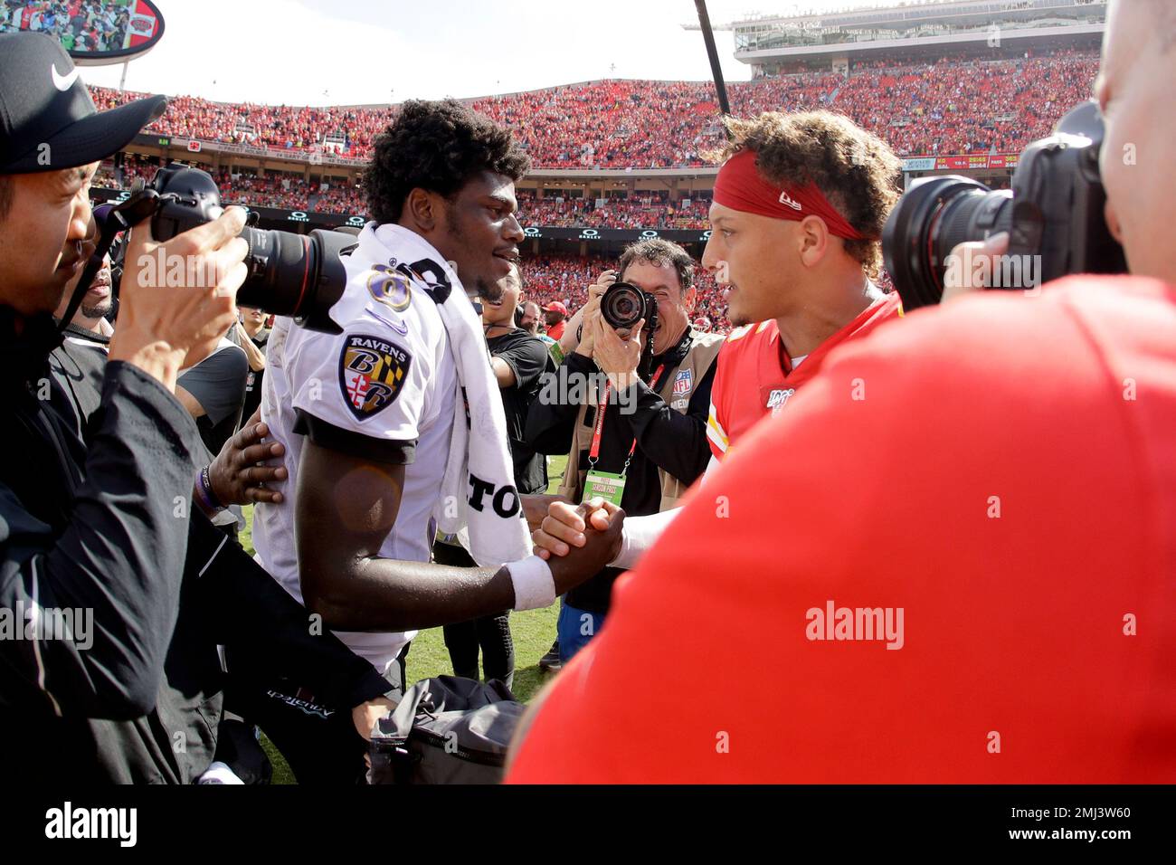 Kansas City Chiefs quarterback Patrick Mahomes, right, and Baltimore ...