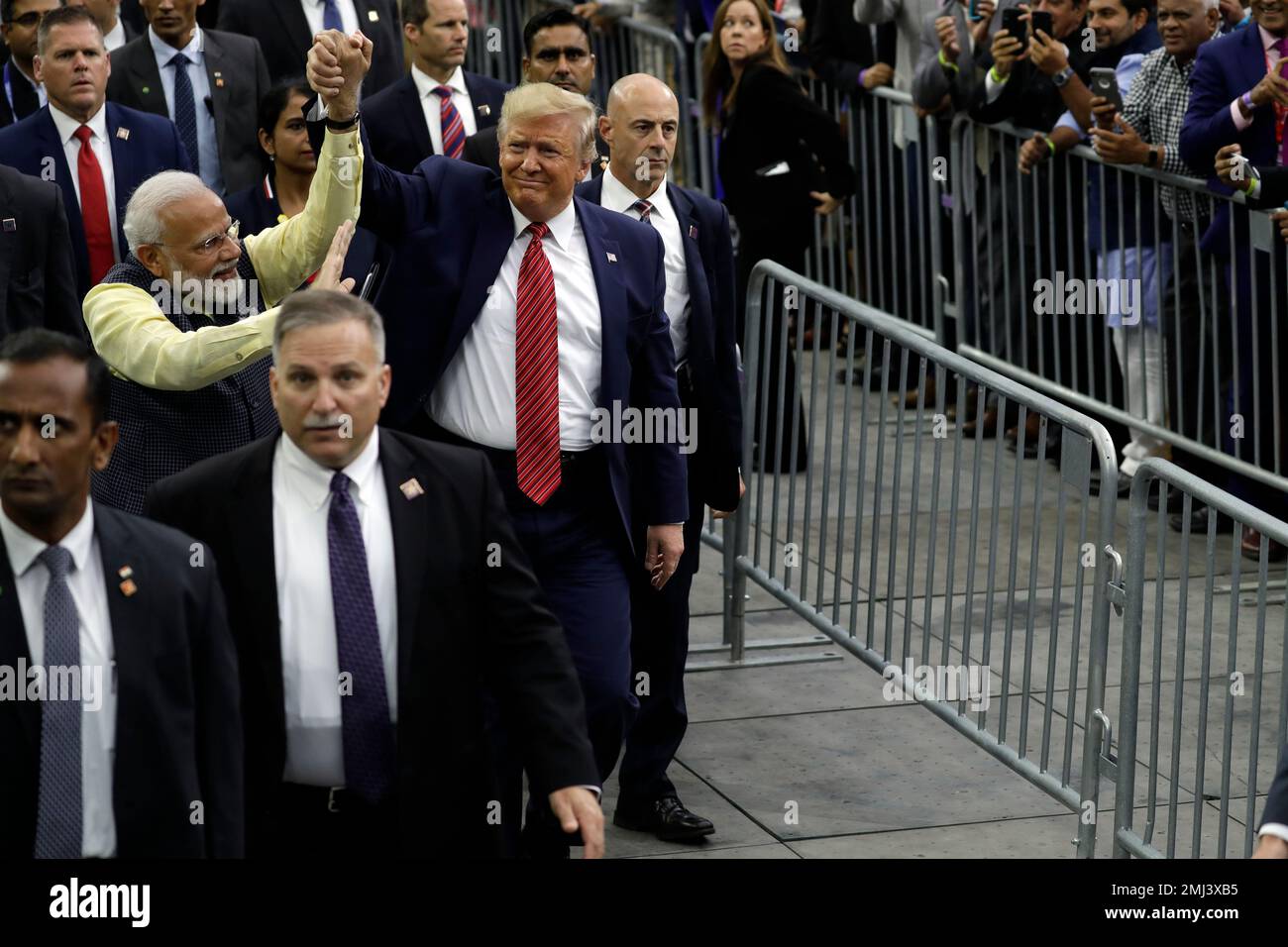 President Donald Trump and Indian Prime Minister Narendra Modi walk ...