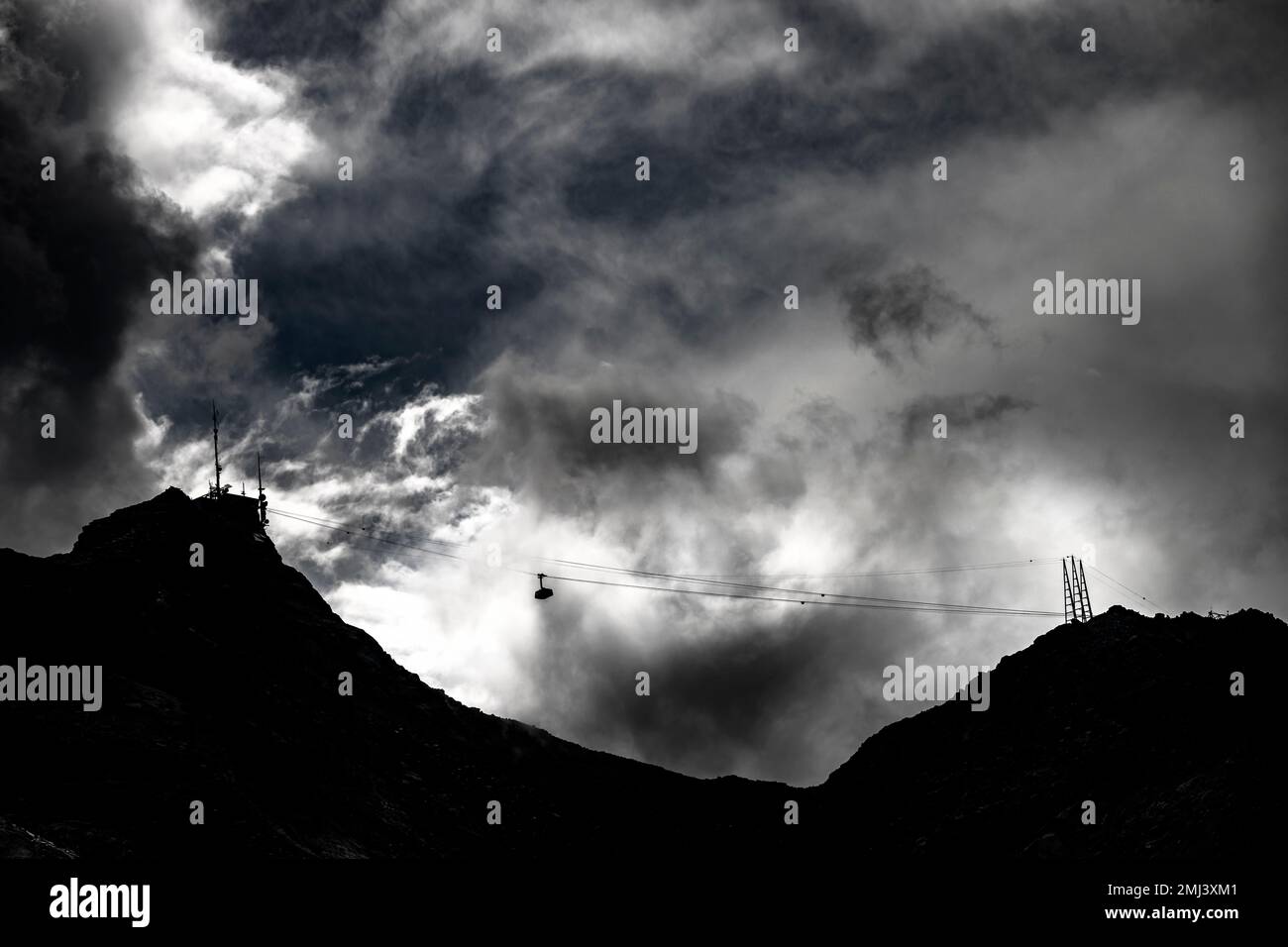 Cable car to Piz Murtel with dramatic clouds, St Moritz, Engadin ...
