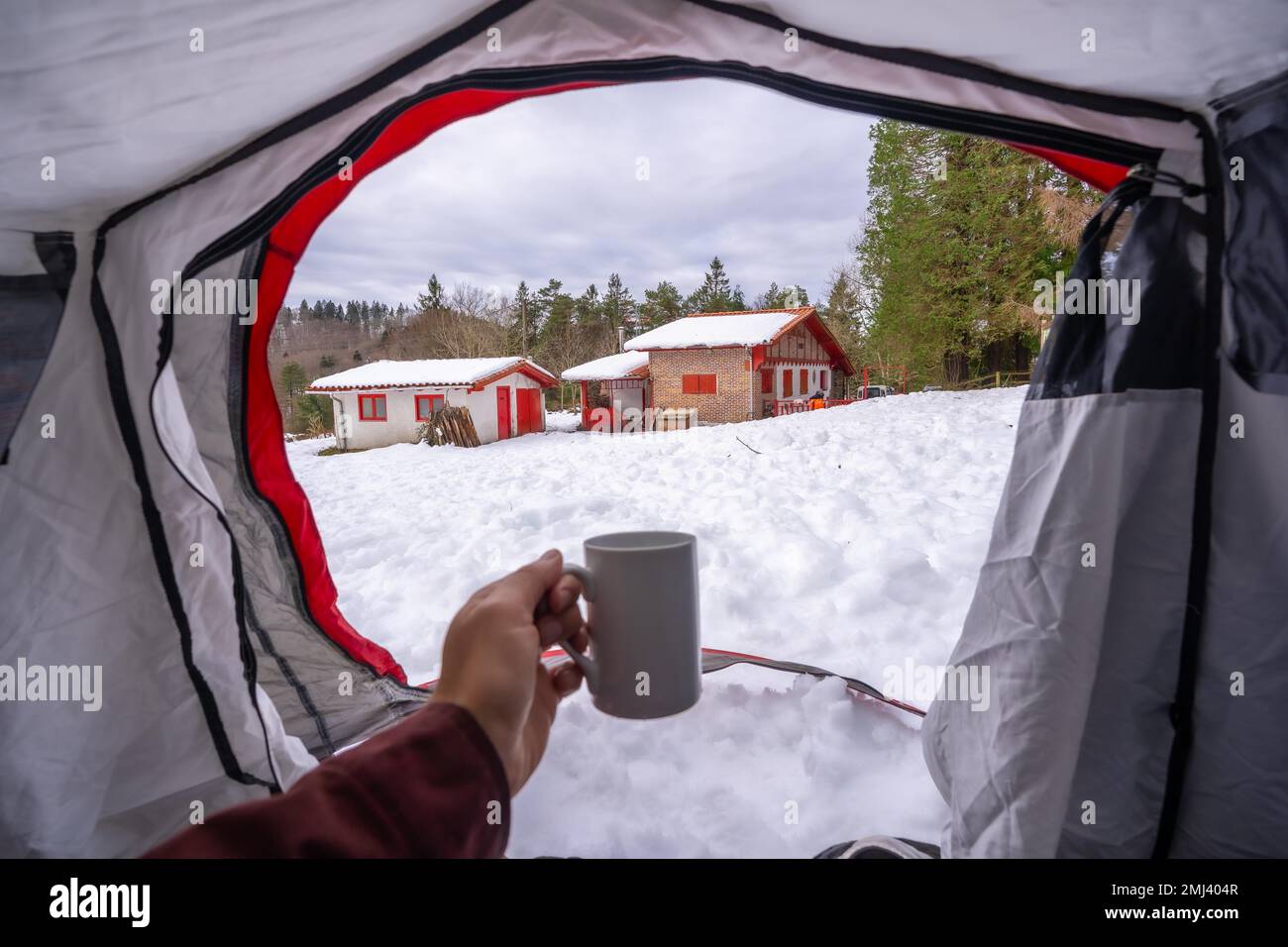 Having a coffee in a cup inside a tent on a winter morning, winter free ...