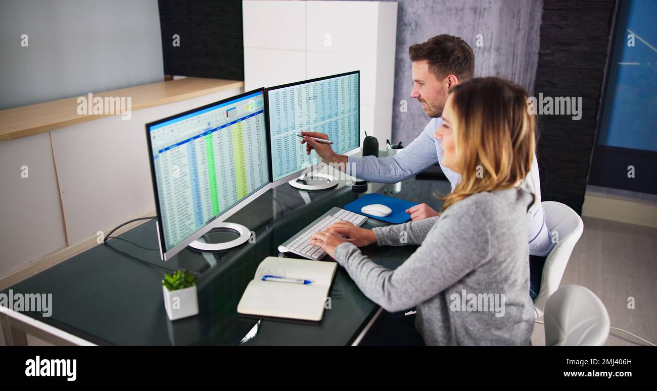 Analyst Employee Working On Spreadsheet Using Desktop Computer Stock ...