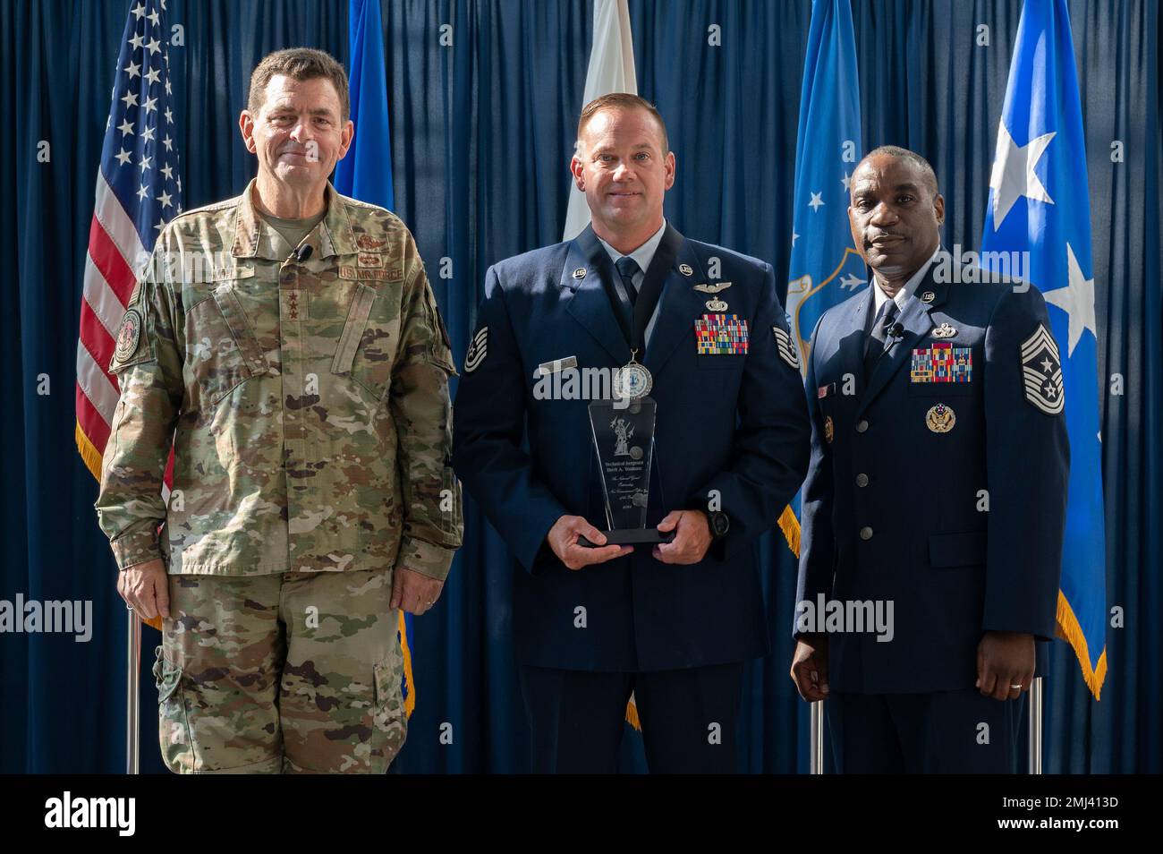 U.S. Air Force Tech Sgt. Brett A. Yoakum, center, of the 164th Airlift ...