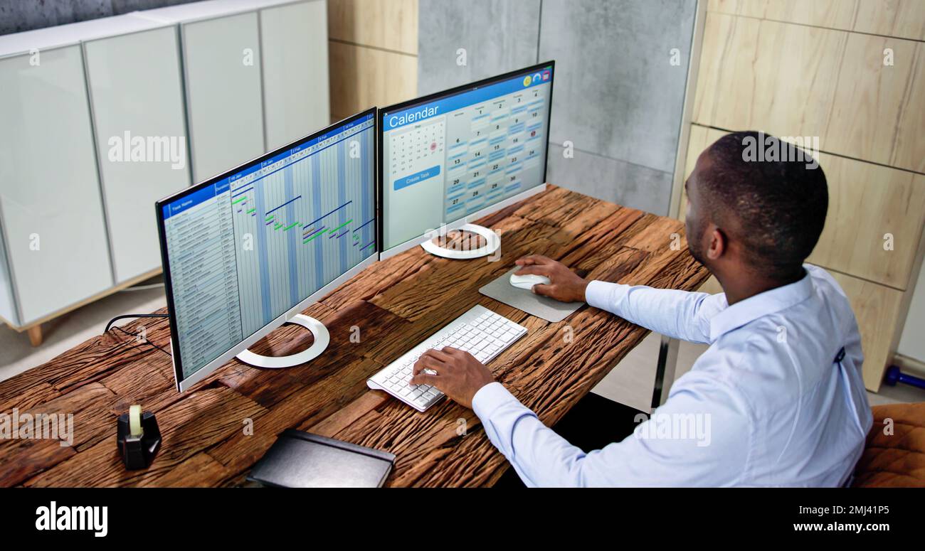 Gantt Chart Calendar Schedule On Multiple Computers Stock Photo - Alamy