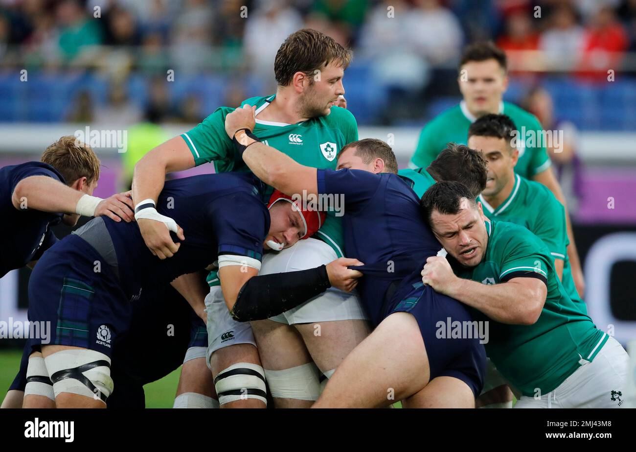 Ireland's Iain Henderson, center, is caught in the middle of a maul ...