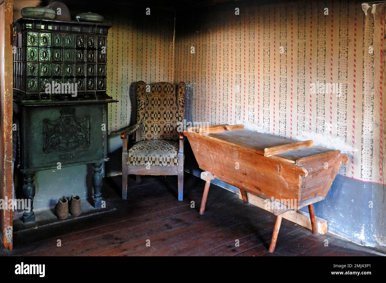 Stube, 1912, with tiled stove, 1854, armchair and dough trough in a ...