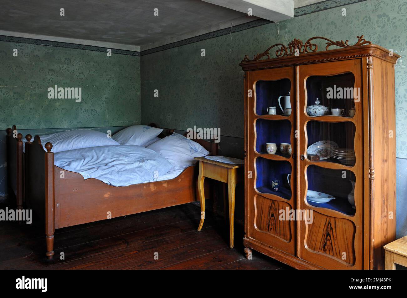 Upper parlour, 1912, with glass cabinet and guest beds in the farmhouse ...