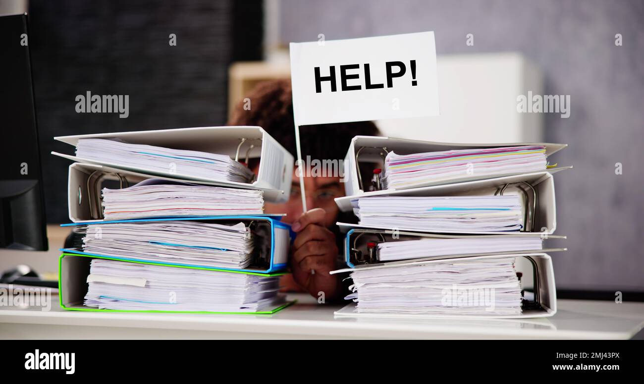 Sad Men In Office With Tax Workload And Paper Files Holding Help Flag ...