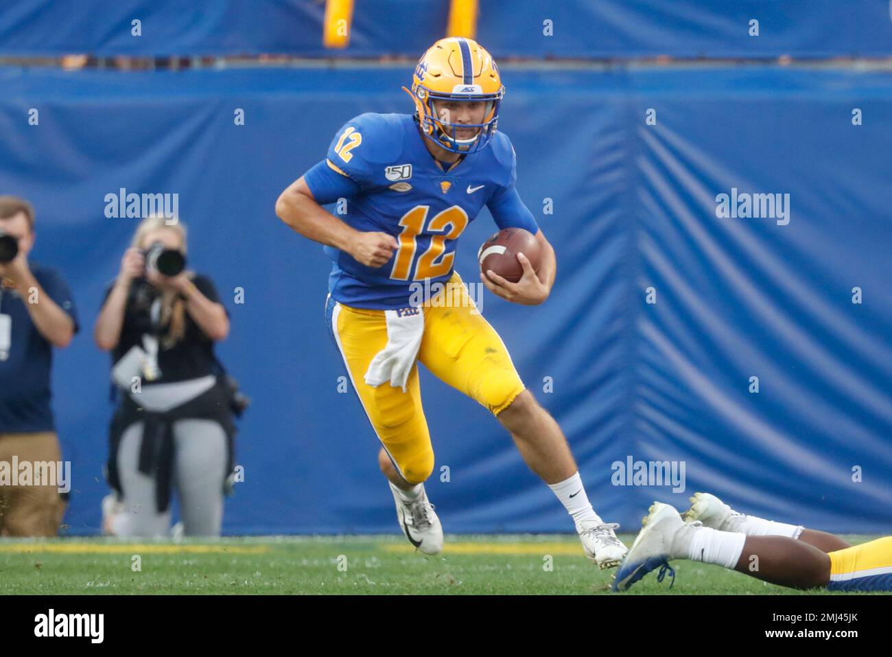 Pittsburgh quarterback Nick Patti (12) runs with the ball against ...
