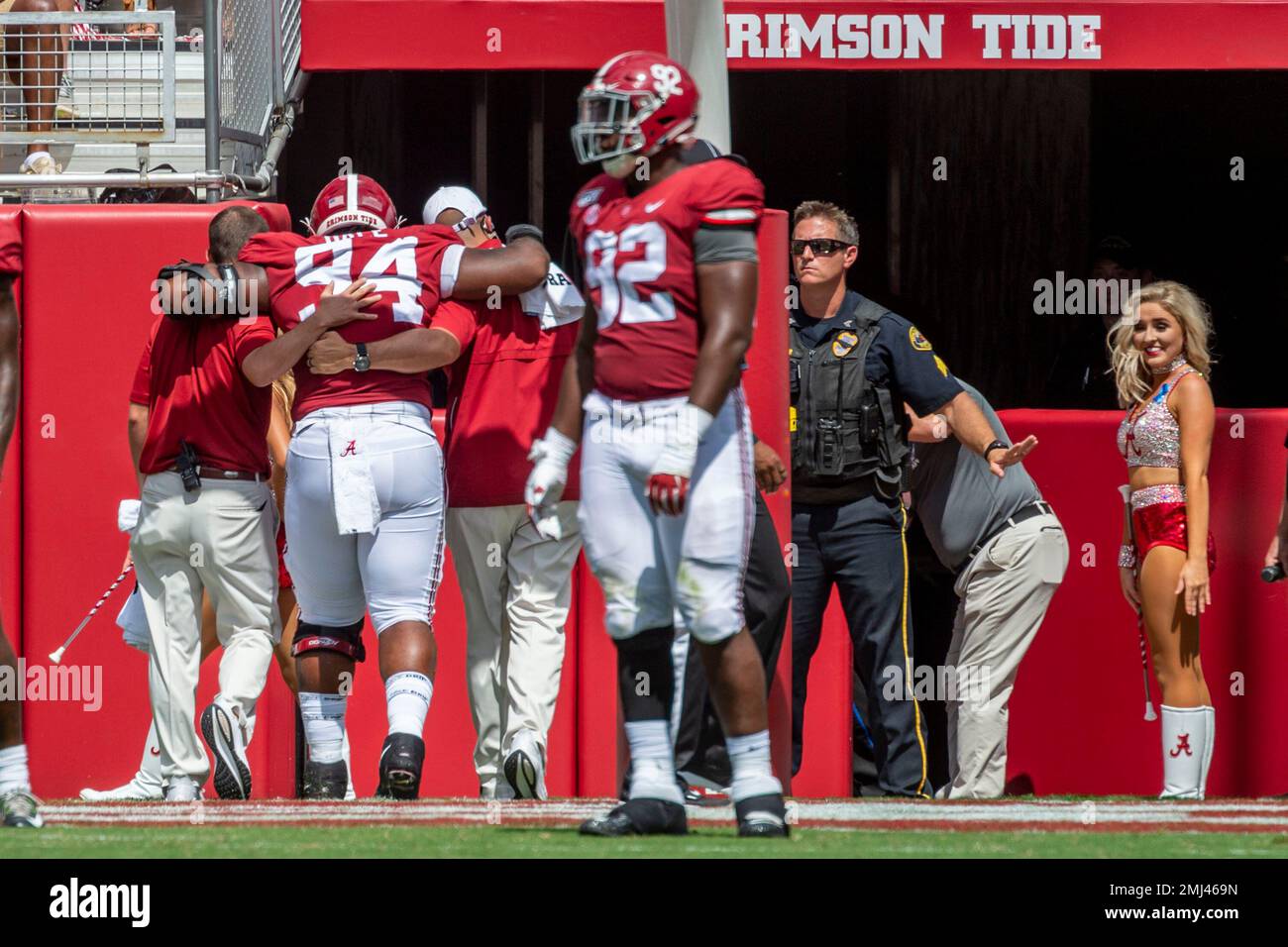 Alabama defensive lineman DJ Dale (94) is helped off the field after an ...