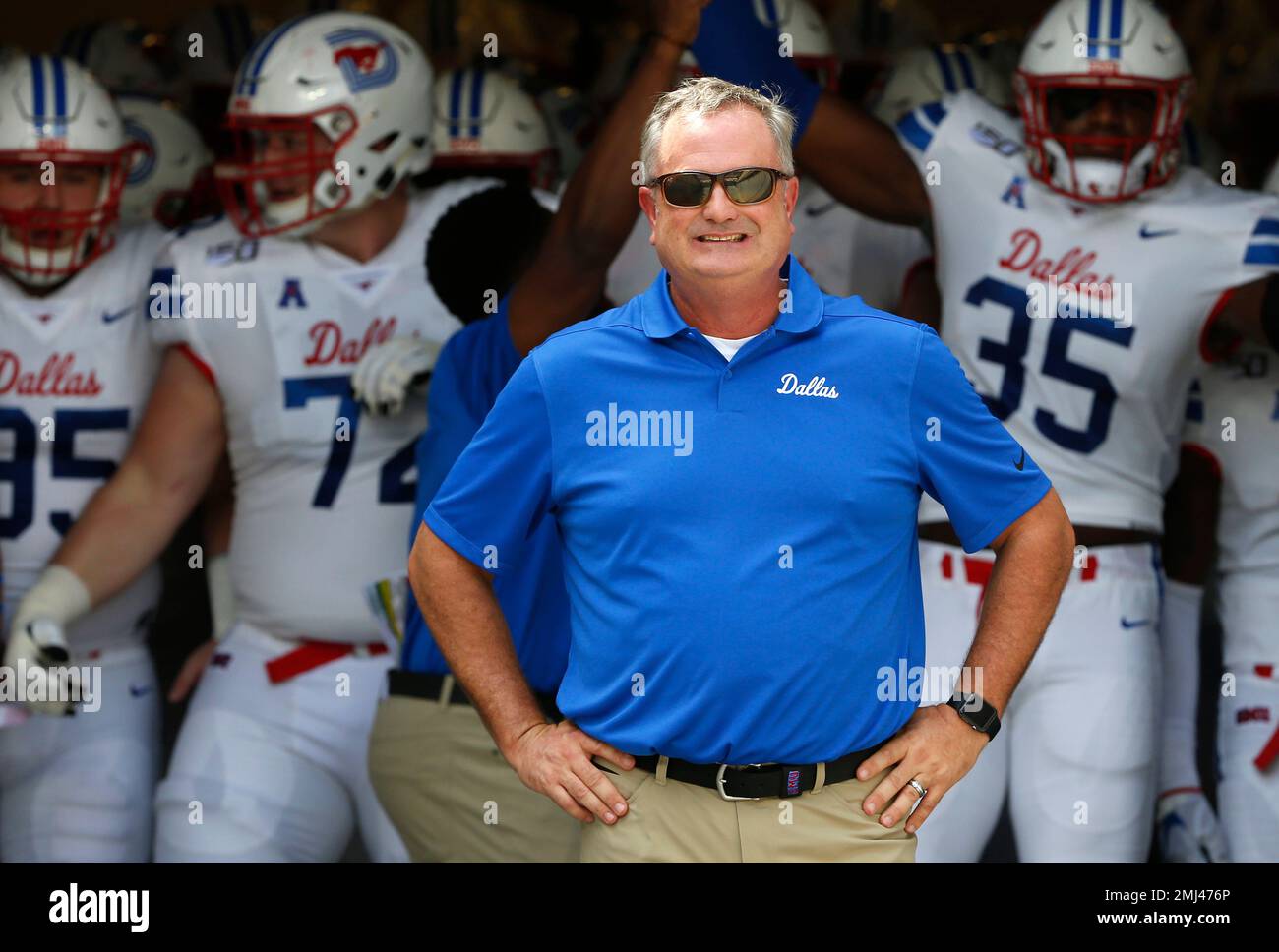 SMU head coach Sonny Dykes waits with his team before playing TCU in an ...