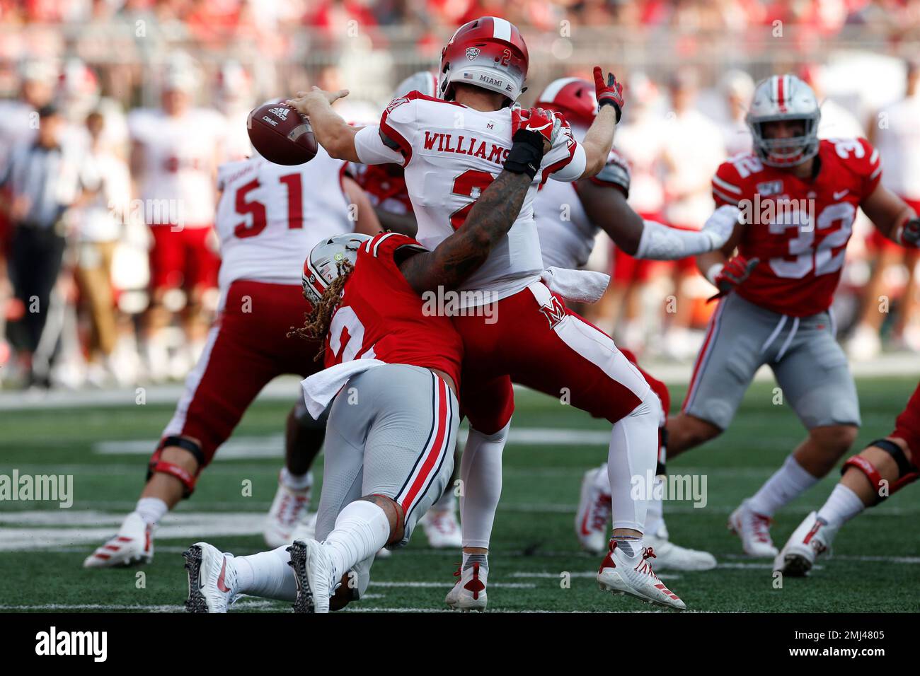 Ohio State defensive end Chase Young, left, sacks Miami (Ohio ...