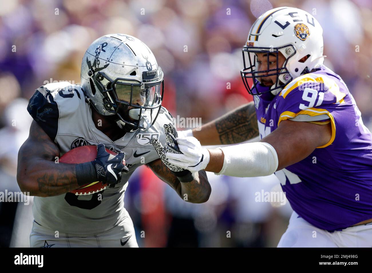 Vanderbilt running back Ke'Shawn Vaughn (5) tries to move past LSU ...