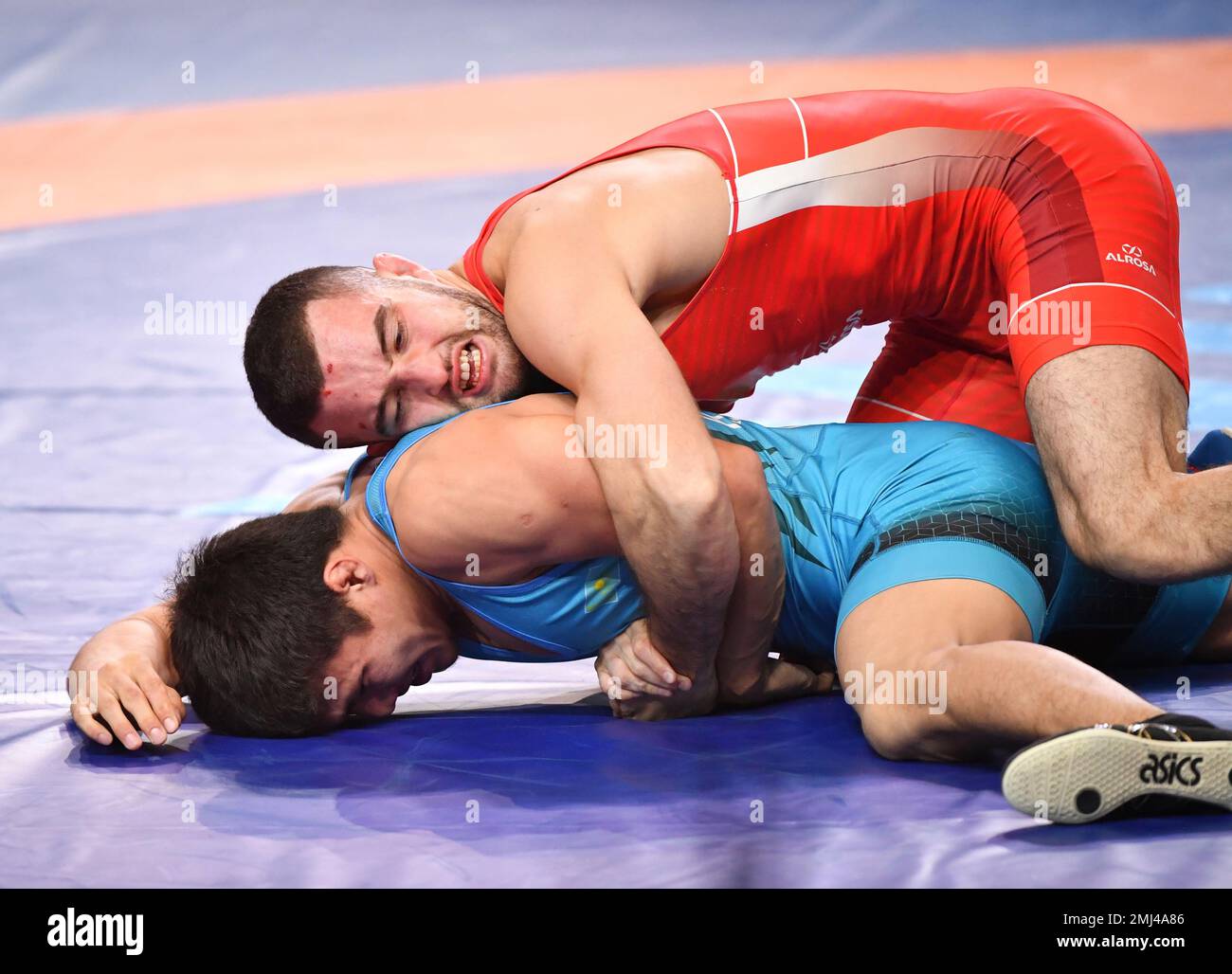David Baev of Russia, top, and Nurkozha Kaipanov of Kazakhstan compete at the gold match of the ...