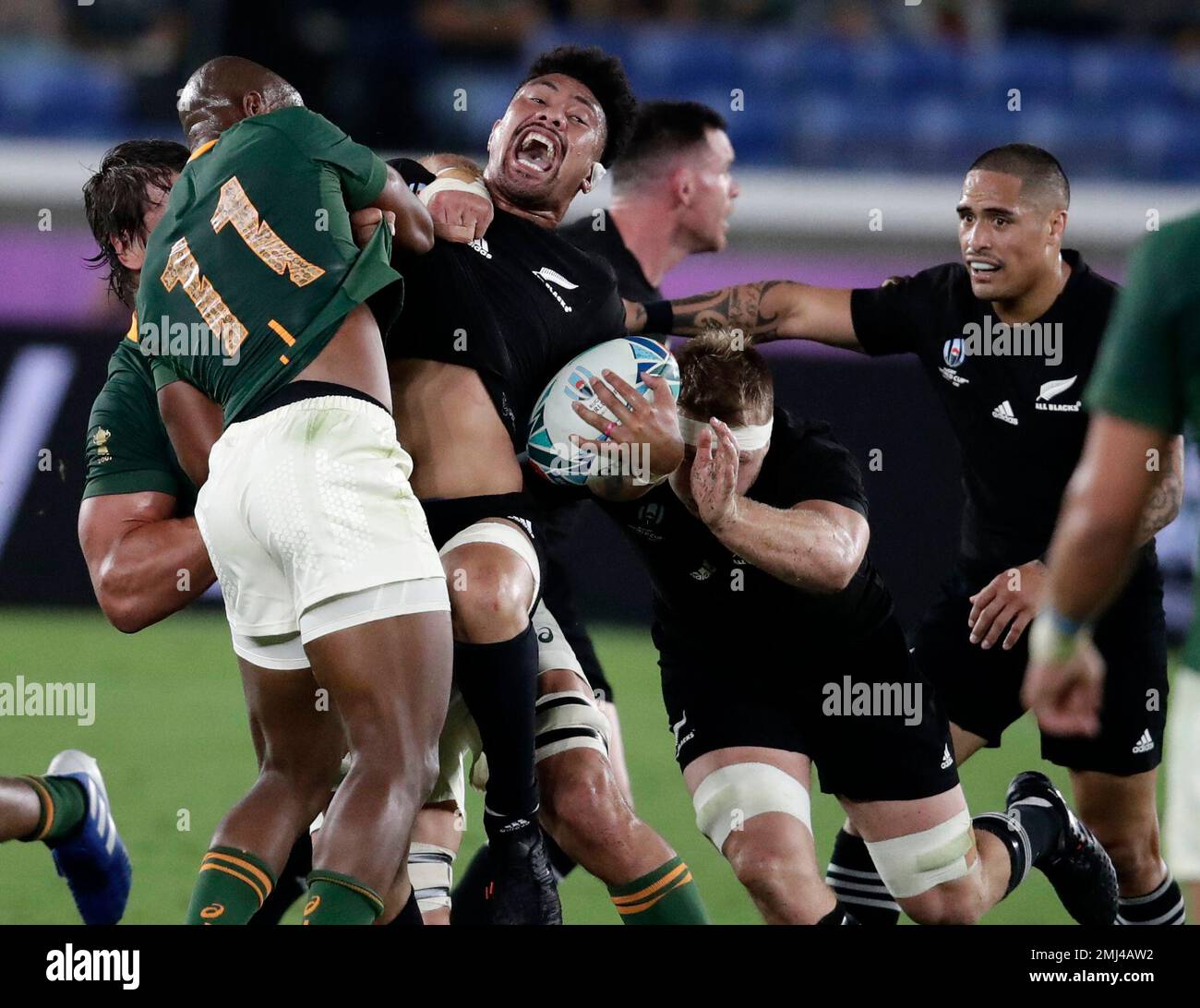 New Zealand's Ardie Savea reacts as he is tackled by South Africa's ...