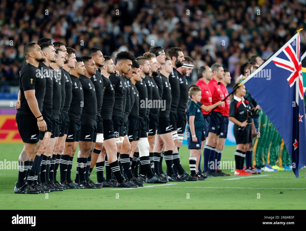 New Zealand's All Blacks stand for their national anthem before the ...