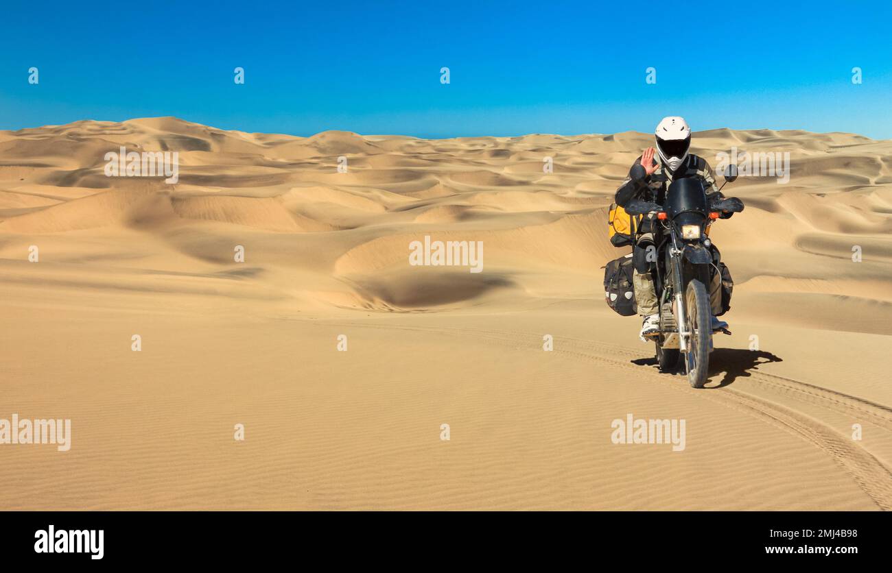 One Motorbiker driving in sand dune desert. Motorcycle Adventure in ...