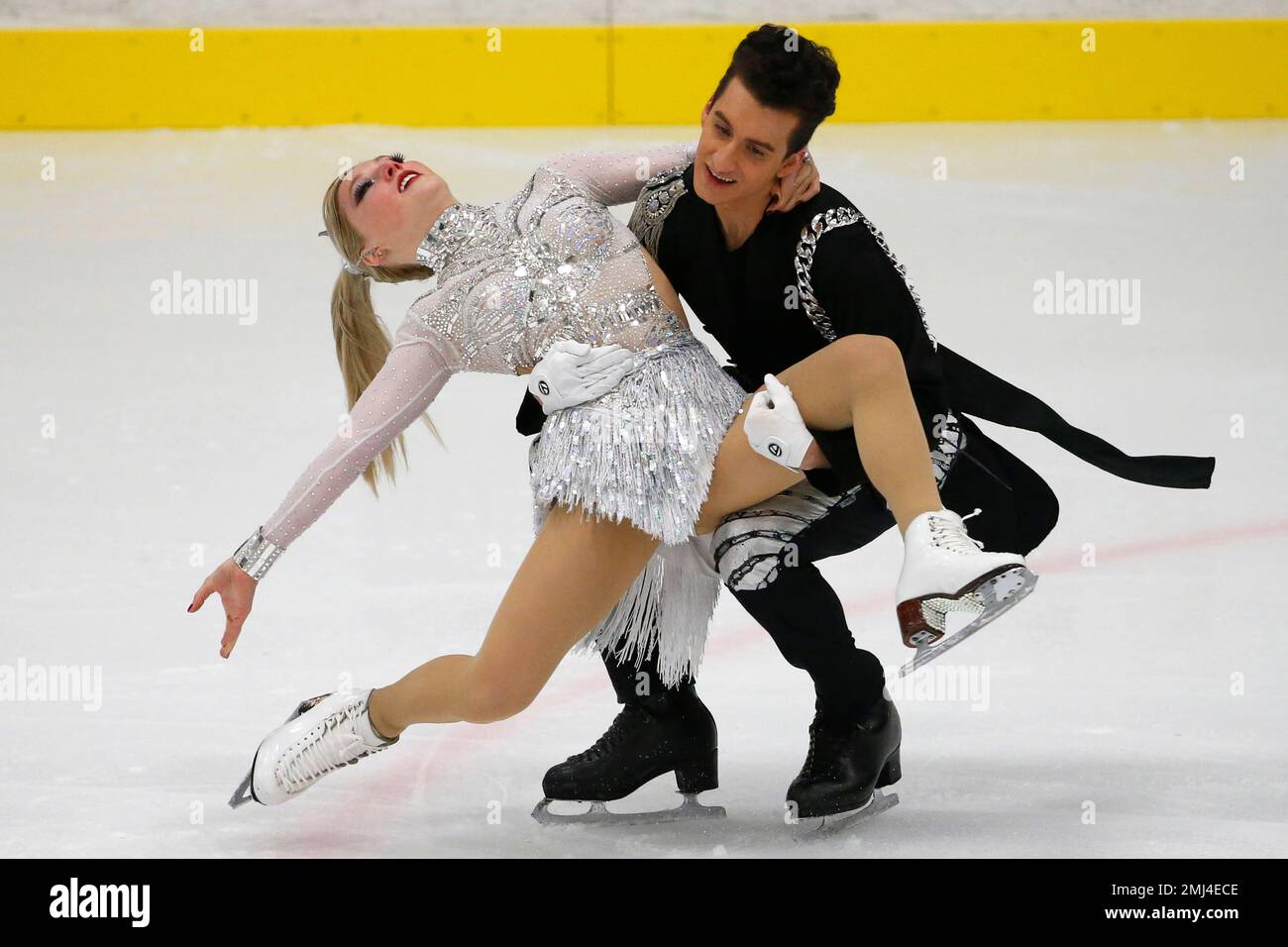 Emily Monaghan and Ilias Fourati, of Hungary, skate during the rhythm ...