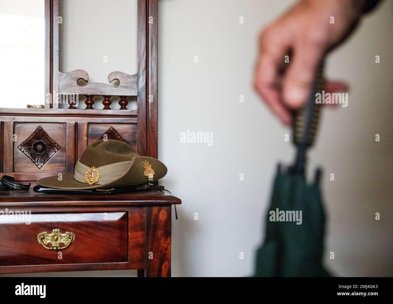 The Army hat of Matthew Tonkin sits on a table as his father, David ...