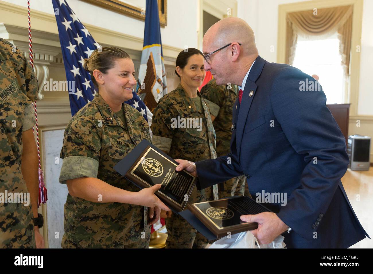 U.S. Marine Corps Chief Warrant Officer 5 Jennifer Mason, an assistant ...