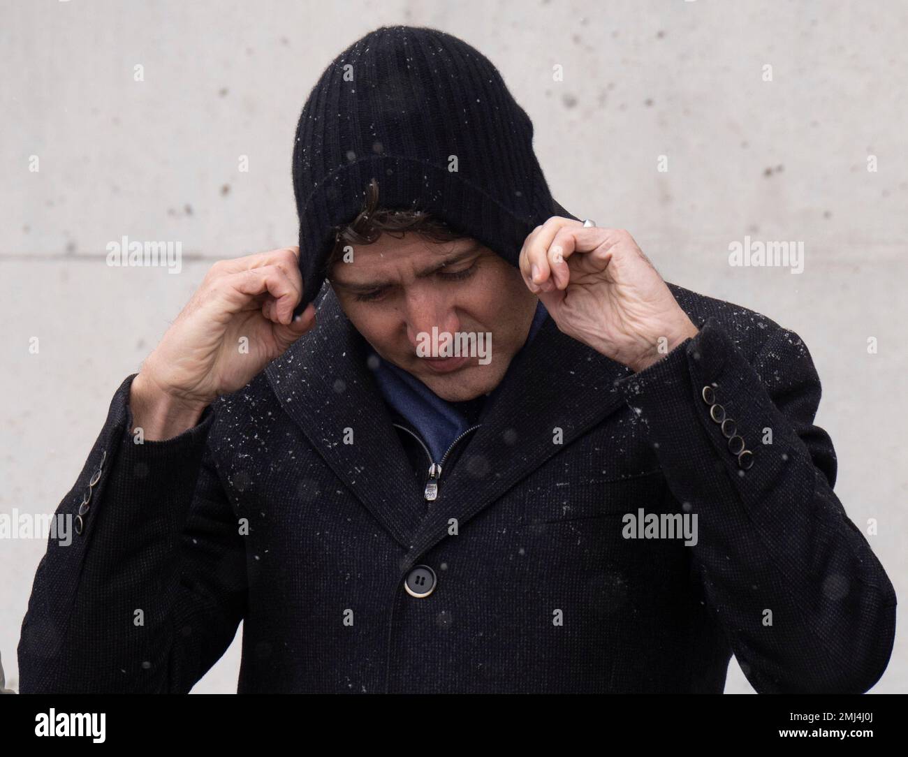 Prime Minister Justin Trudeau puts his hat on during a ceremony at the ...