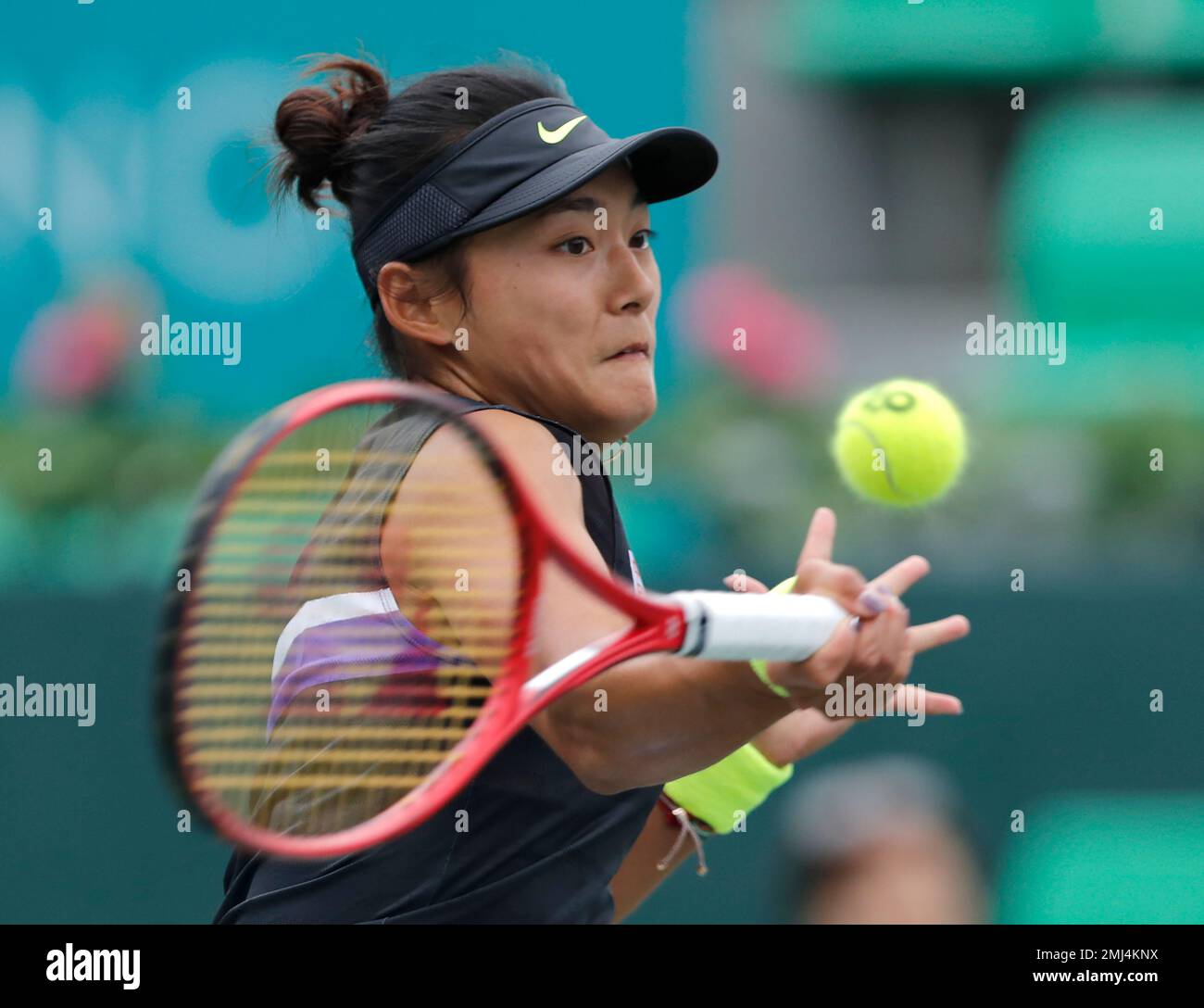 Wang Yafan of China returns a shot to Paula Badosa of Spain during ...