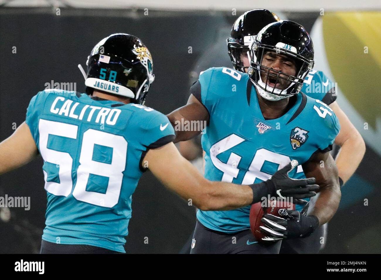 Jacksonville Jaguars outside linebacker Leon Jacobs, center, celebrates ...